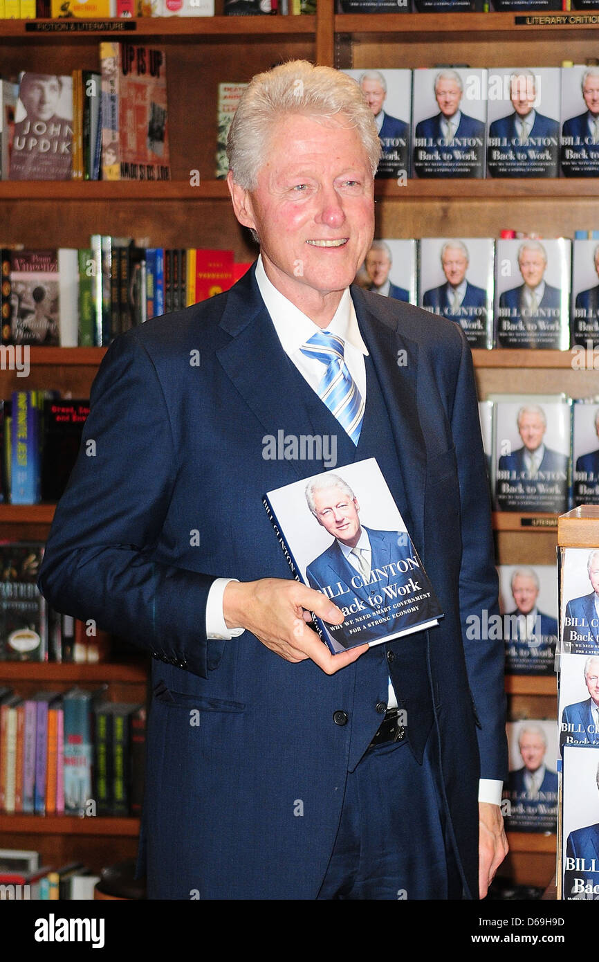 Former U.S. President Bill Clinton signs copies of his new book, 'Back ...