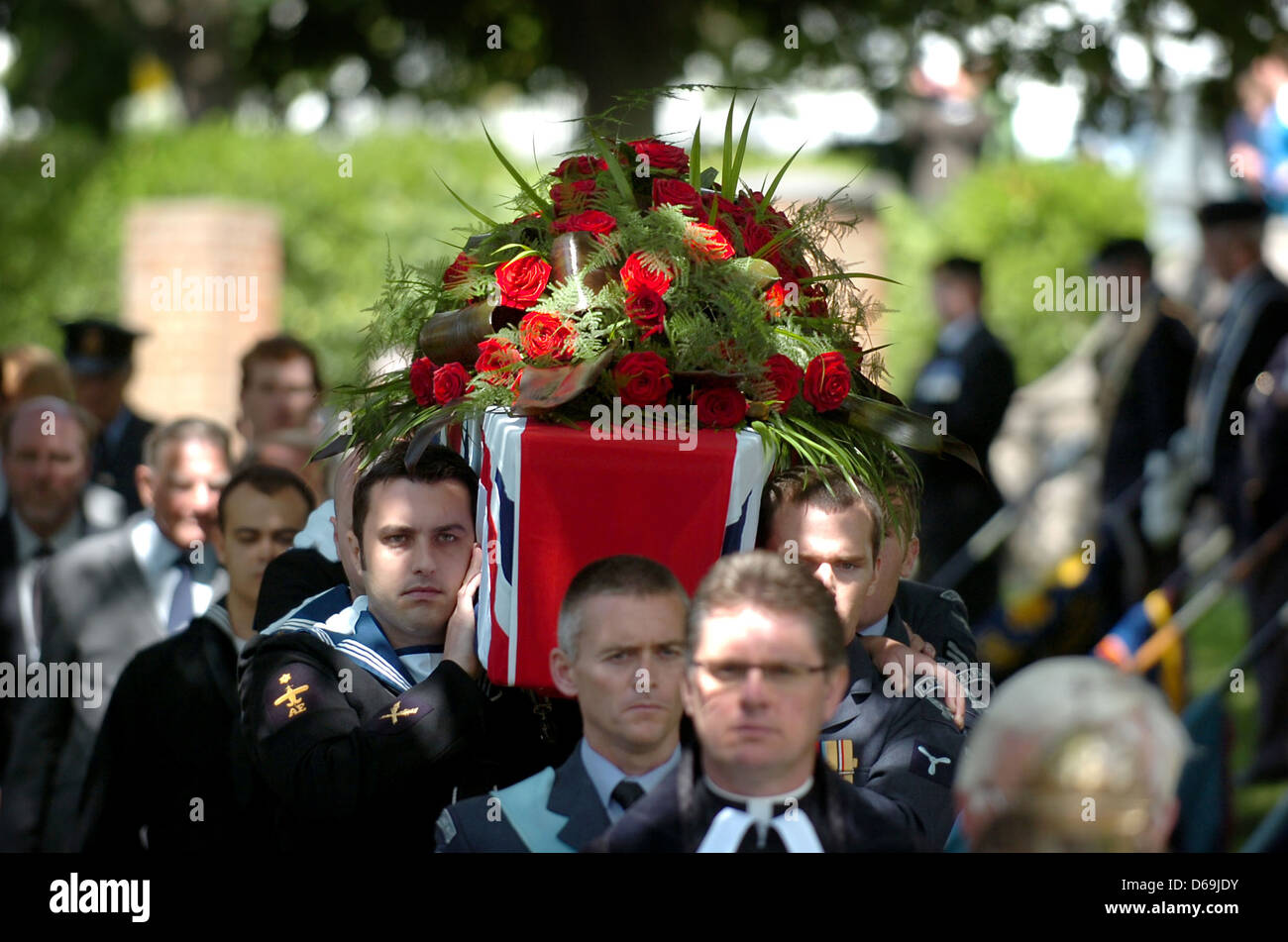 The coffin is carried by the pall bearers for the funeral of Henry ...