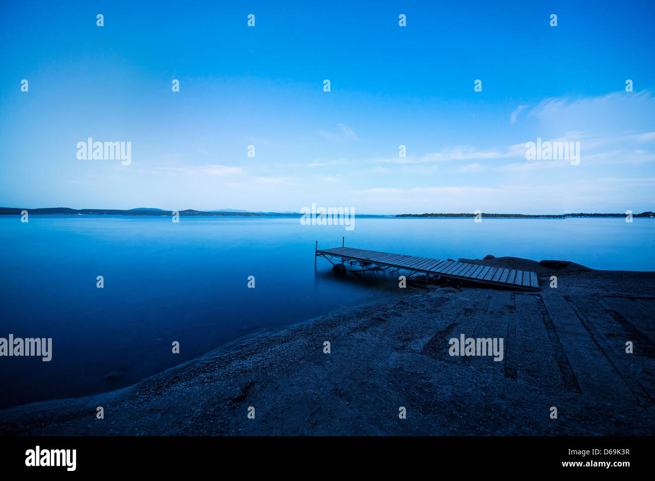 Still lake in rural landscape Stock Photo - Alamy