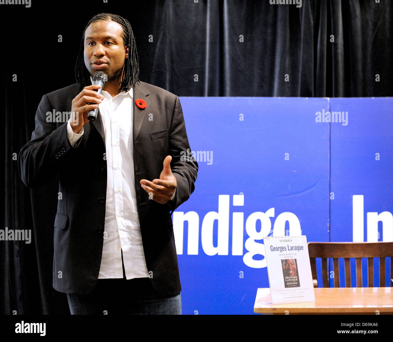 Former NHL player Georges Laraque signs his latest book 'The Story of ...