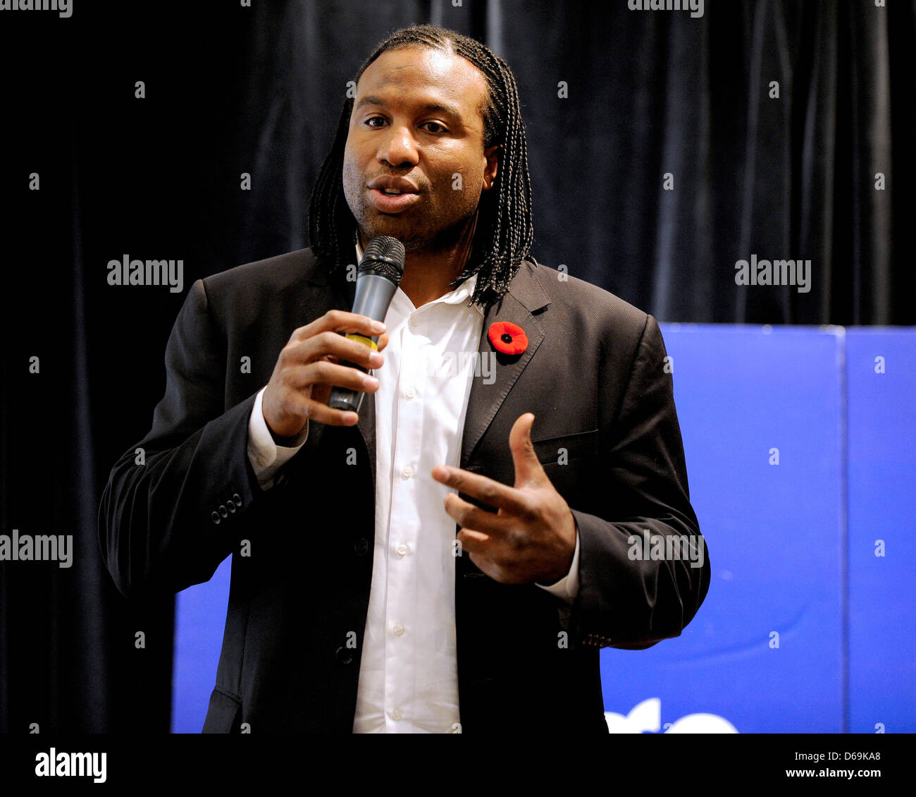 Former NHL player, Georges Laraque, signs his latest book 'The Story of ...