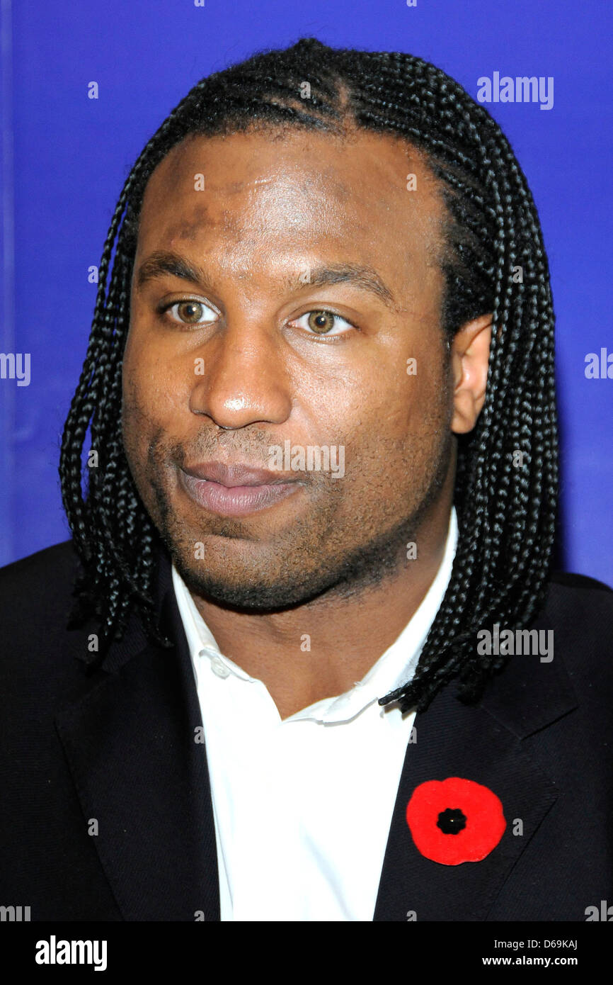 Former NHL player, Georges Laraque, signs his latest book 'The Story of ...