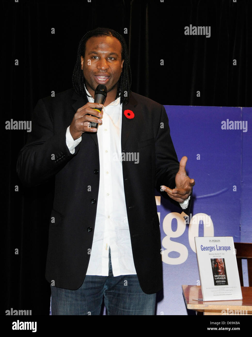 Former NHL player, Georges Laraque, signs his latest book 'The Story of ...