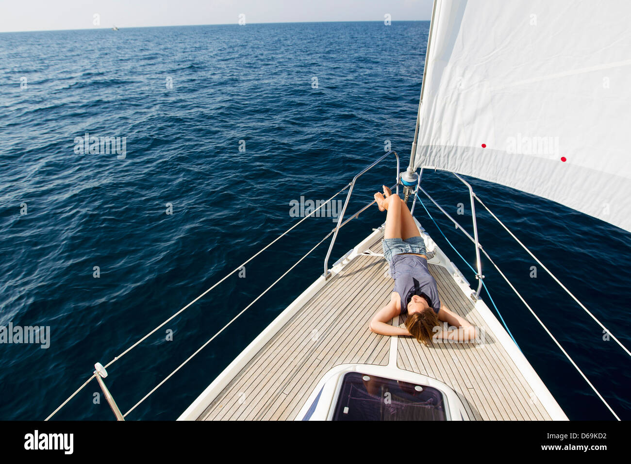 Woman laying on boat hi-res stock photography and images - Alamy