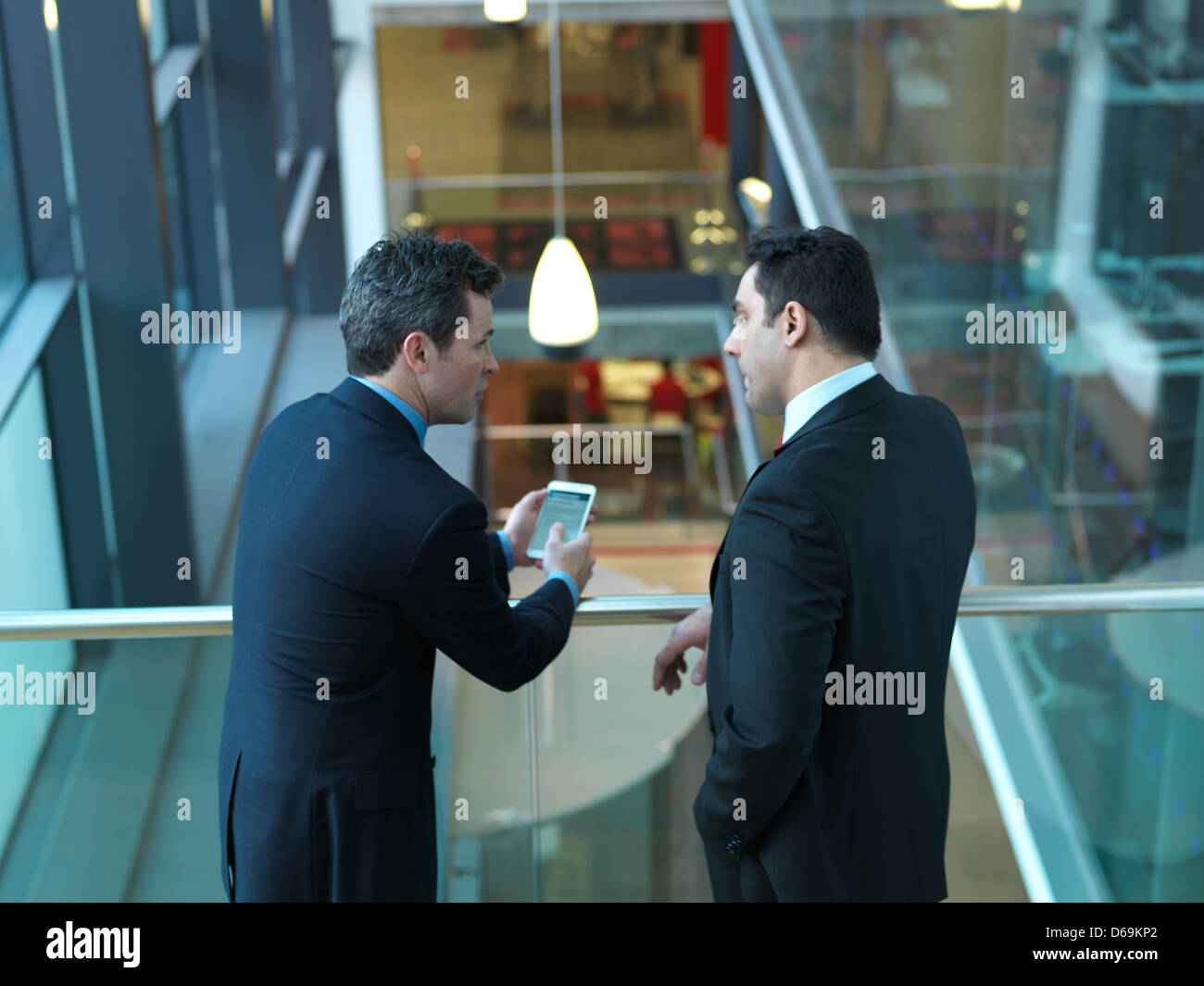 Businessmen talking in office Stock Photo - Alamy