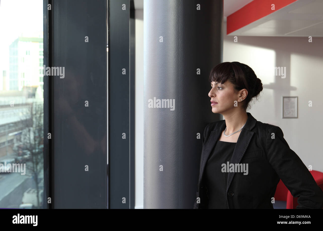 Person looking out of office window hi-res stock photography and images ...