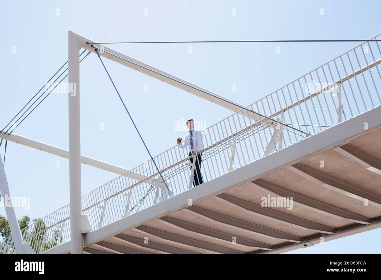 Man leaning on bridge railing hi-res stock photography and images - Alamy