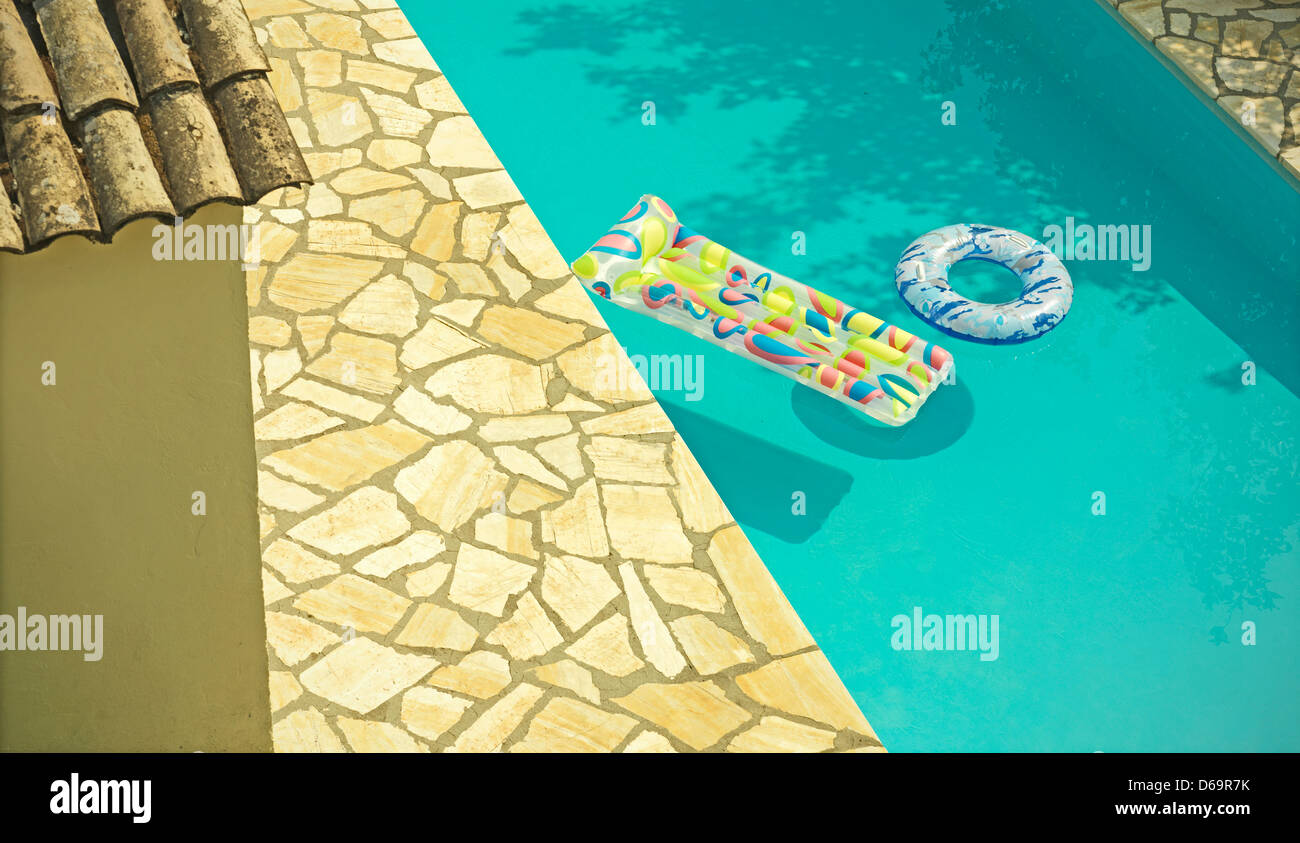 Inflatable rafts in swimming pool Stock Photo - Alamy
