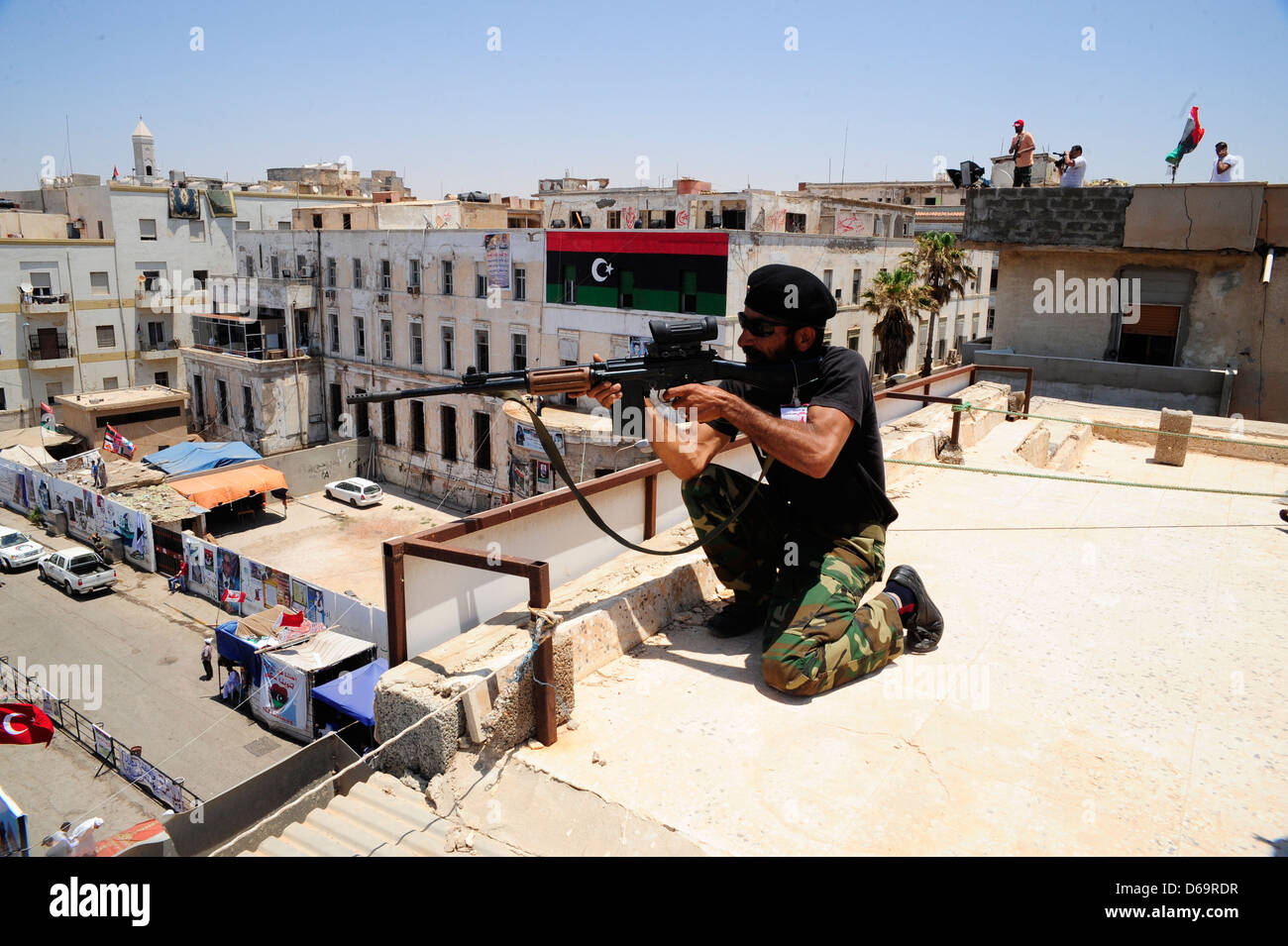 A NLA sniper on the rooftop overlooking the square in Benghazi during ...
