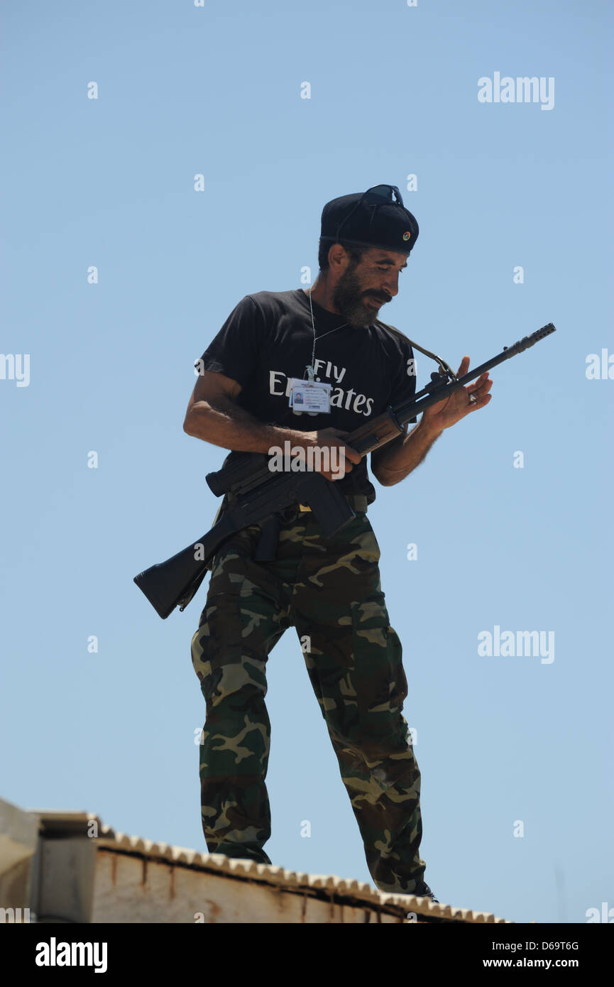 A NLA sniper on the rooftop overlooking the square in Benghazi during ...