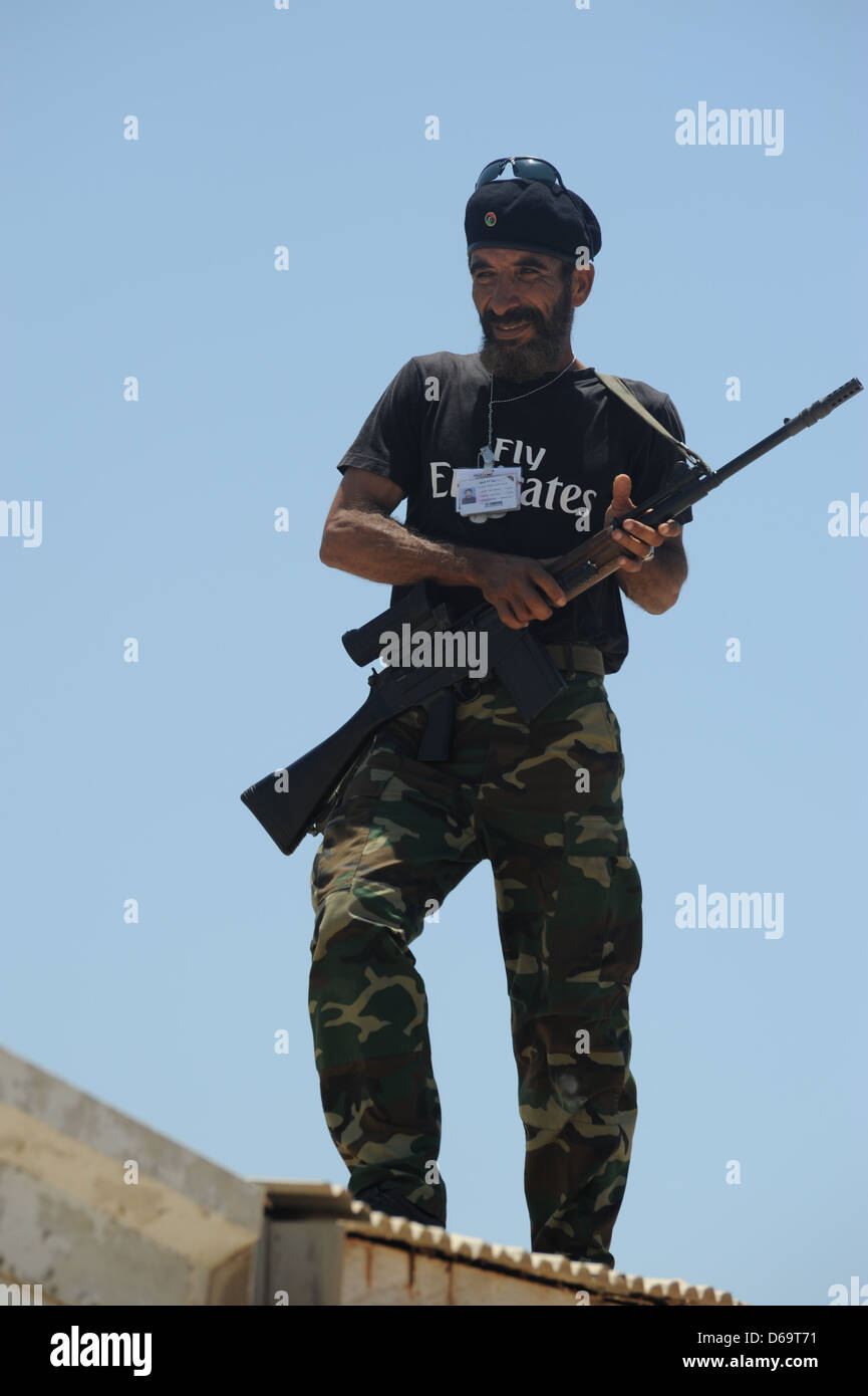 A NLA sniper on the rooftop overlooking the square in Benghazi during ...