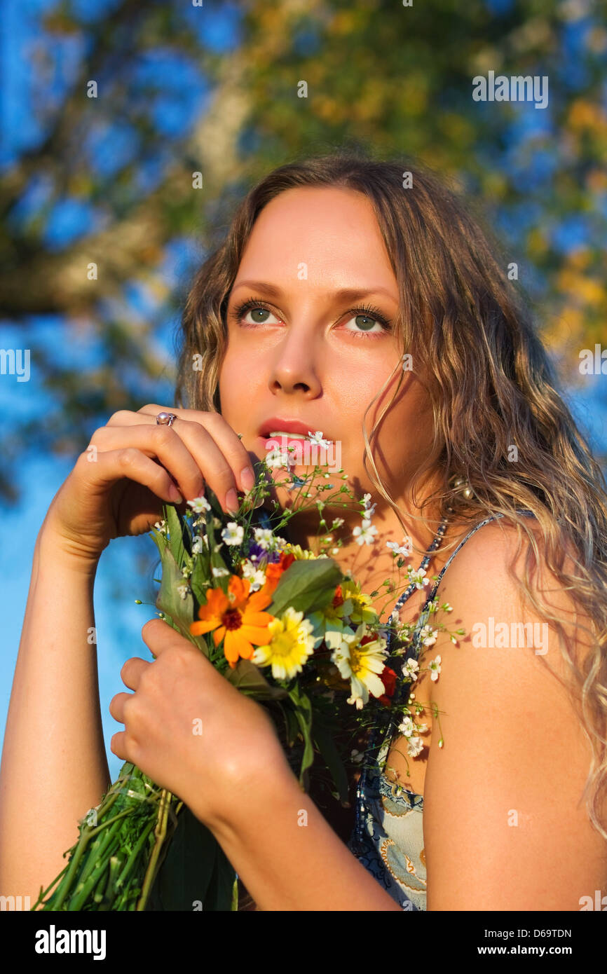Beautiful woman with a flowers Stock Photo - Alamy