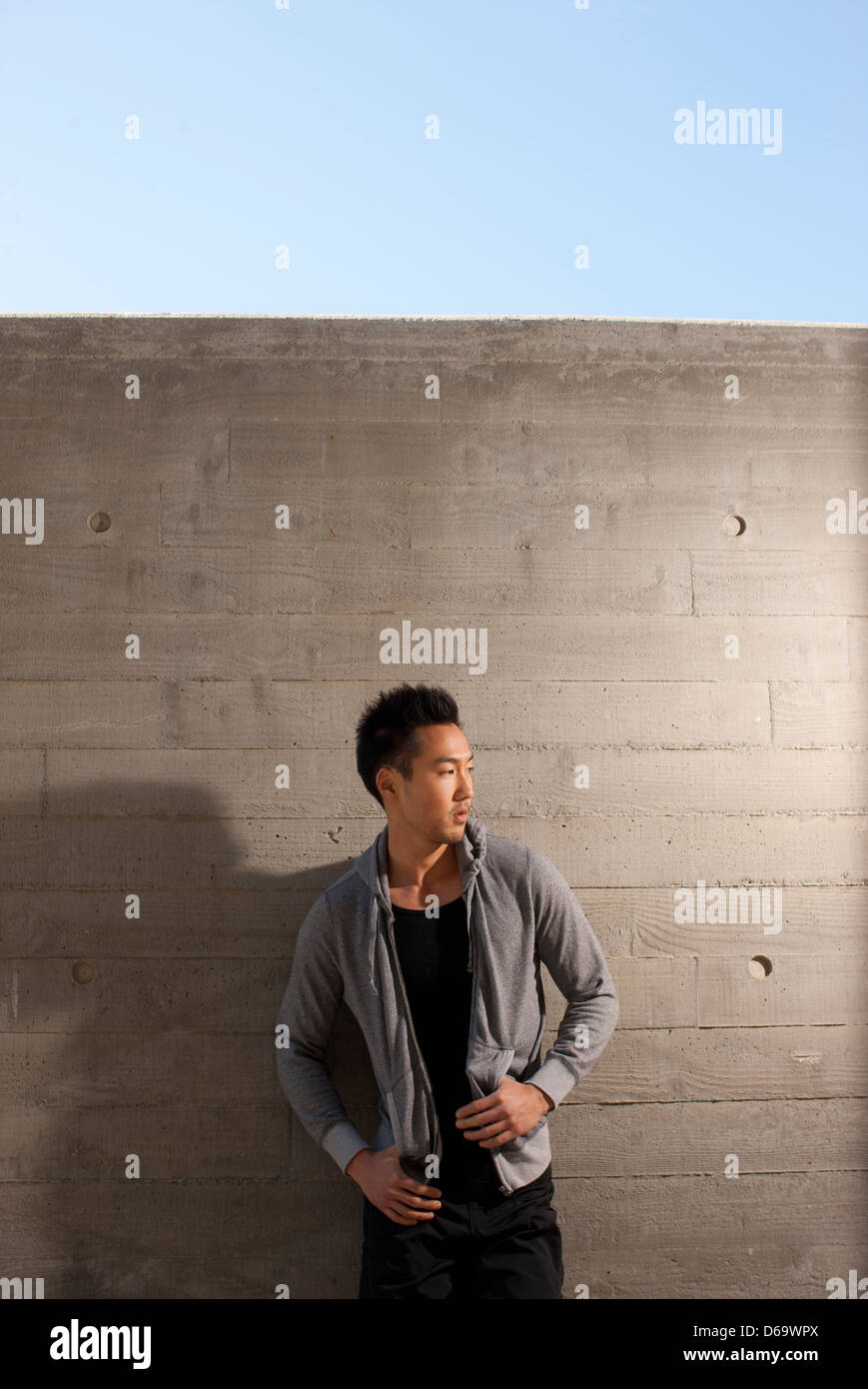 Man leaning on wall with hand hi-res stock photography and images - Alamy