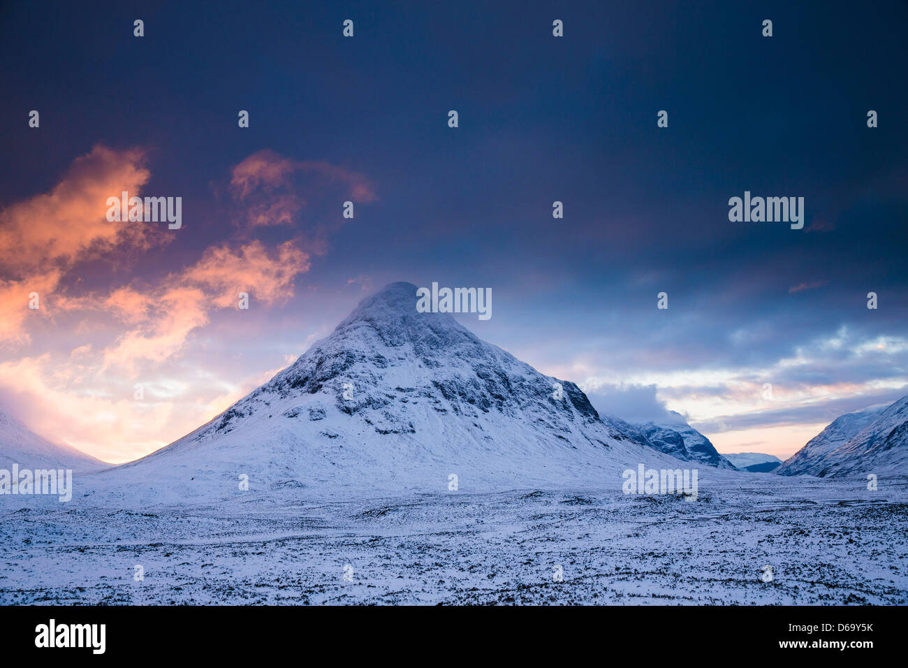 Rocky mountains in snowy landscape Stock Photo - Alamy