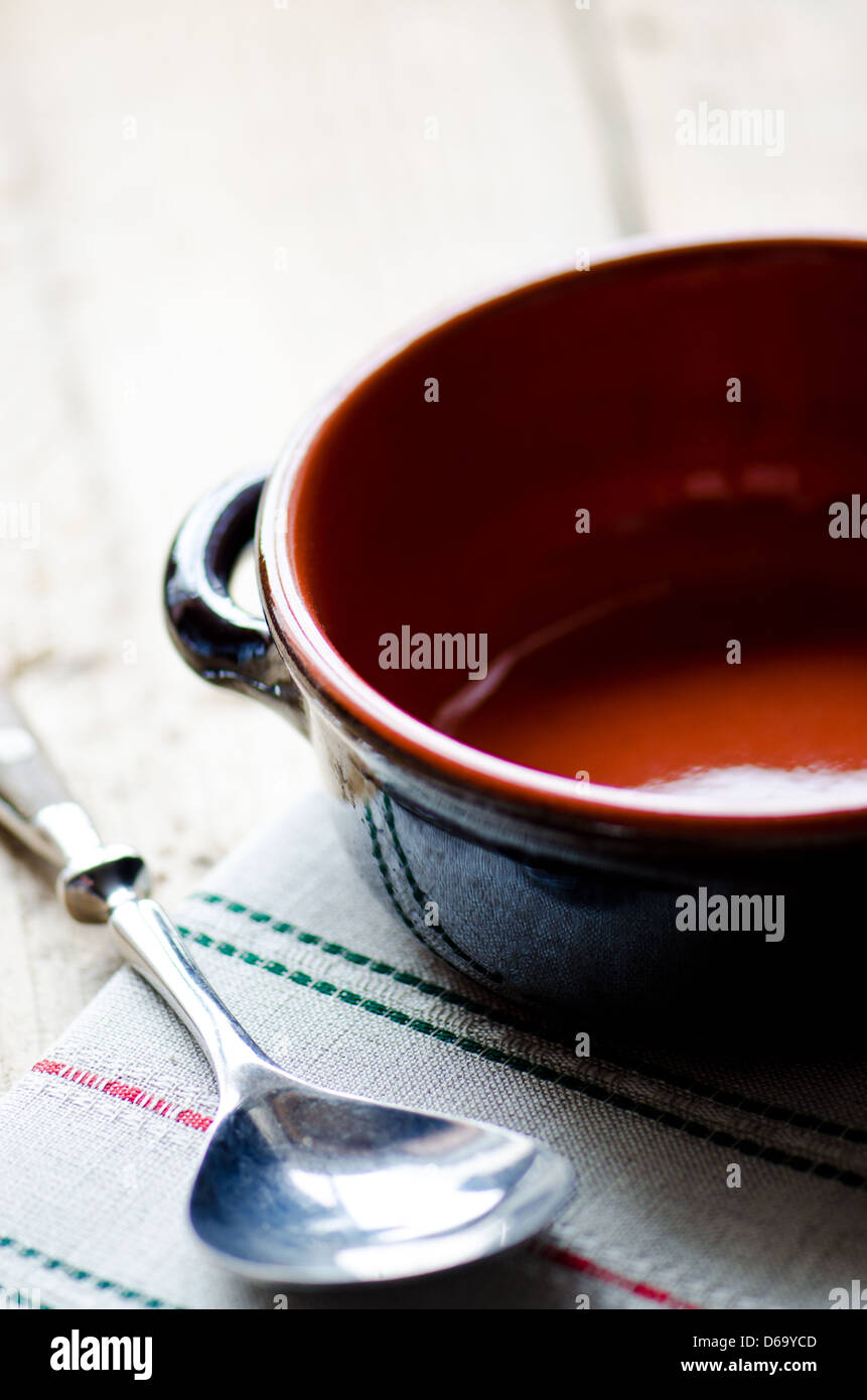 Empty bowl and spoon on the table Stock Photo - Alamy