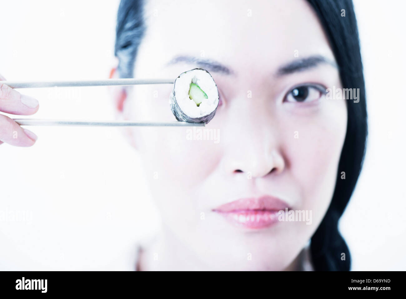 Woman eating piece sushi hi-res stock photography and images - Alamy