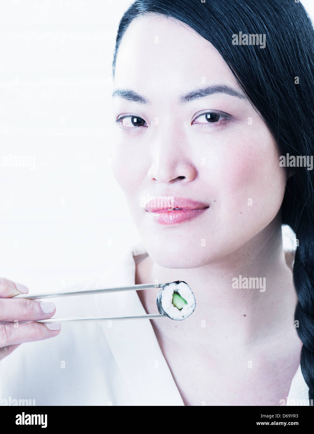 Woman eating piece sushi hi-res stock photography and images - Alamy