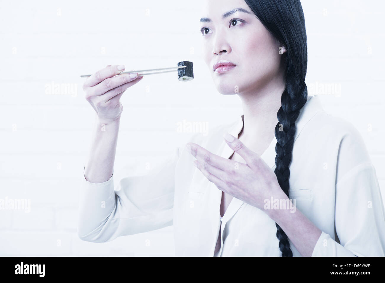 Woman eating piece sushi hi-res stock photography and images - Alamy