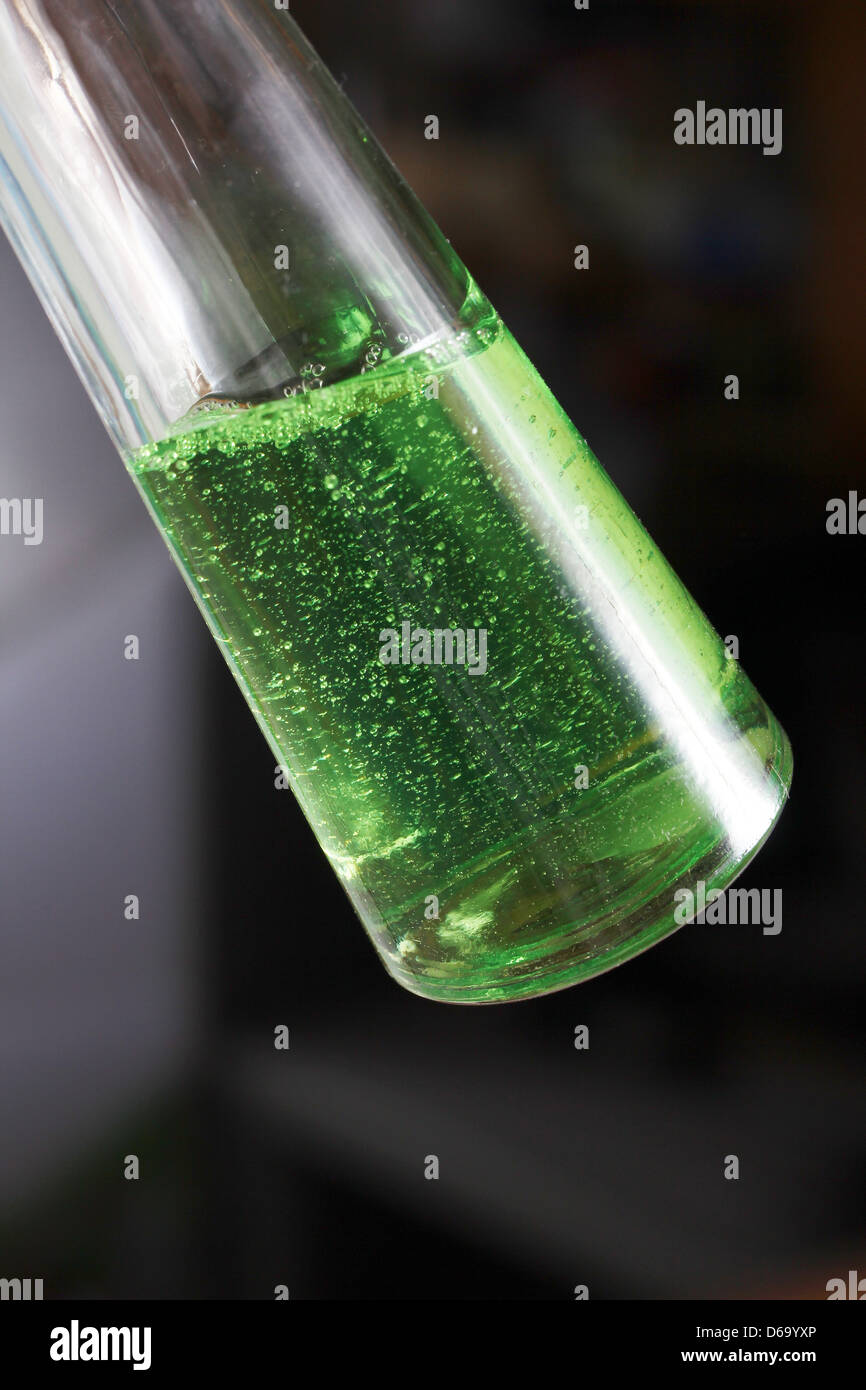 green liquid in a test tube Stock Photo - Alamy