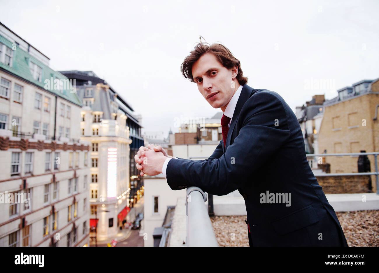 Business man standing on rooftop hi-res stock photography and images ...