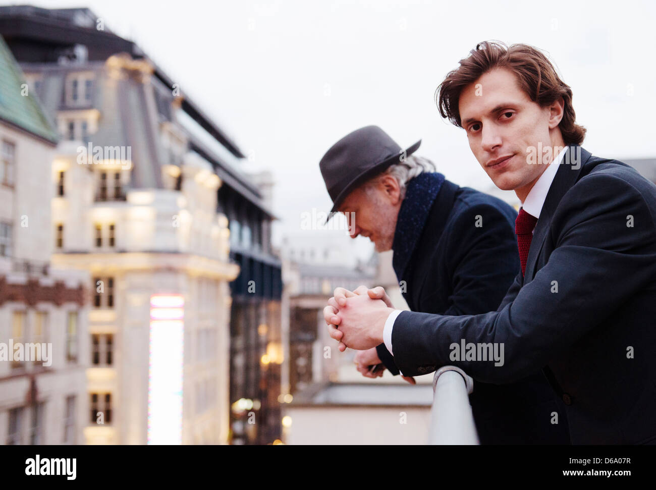 Two people standing on balcony hi-res stock photography and images - Alamy