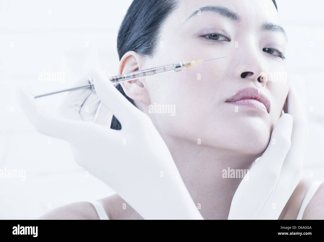 Woman having Botox injection in face Stock Photo - Alamy