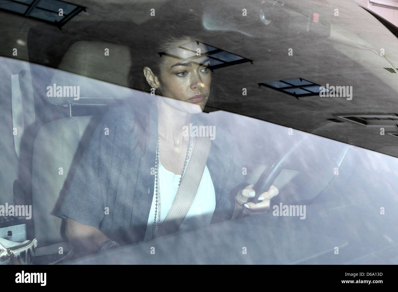 Denise Richards driving out of a parking garage in Beverly Hills on the ...