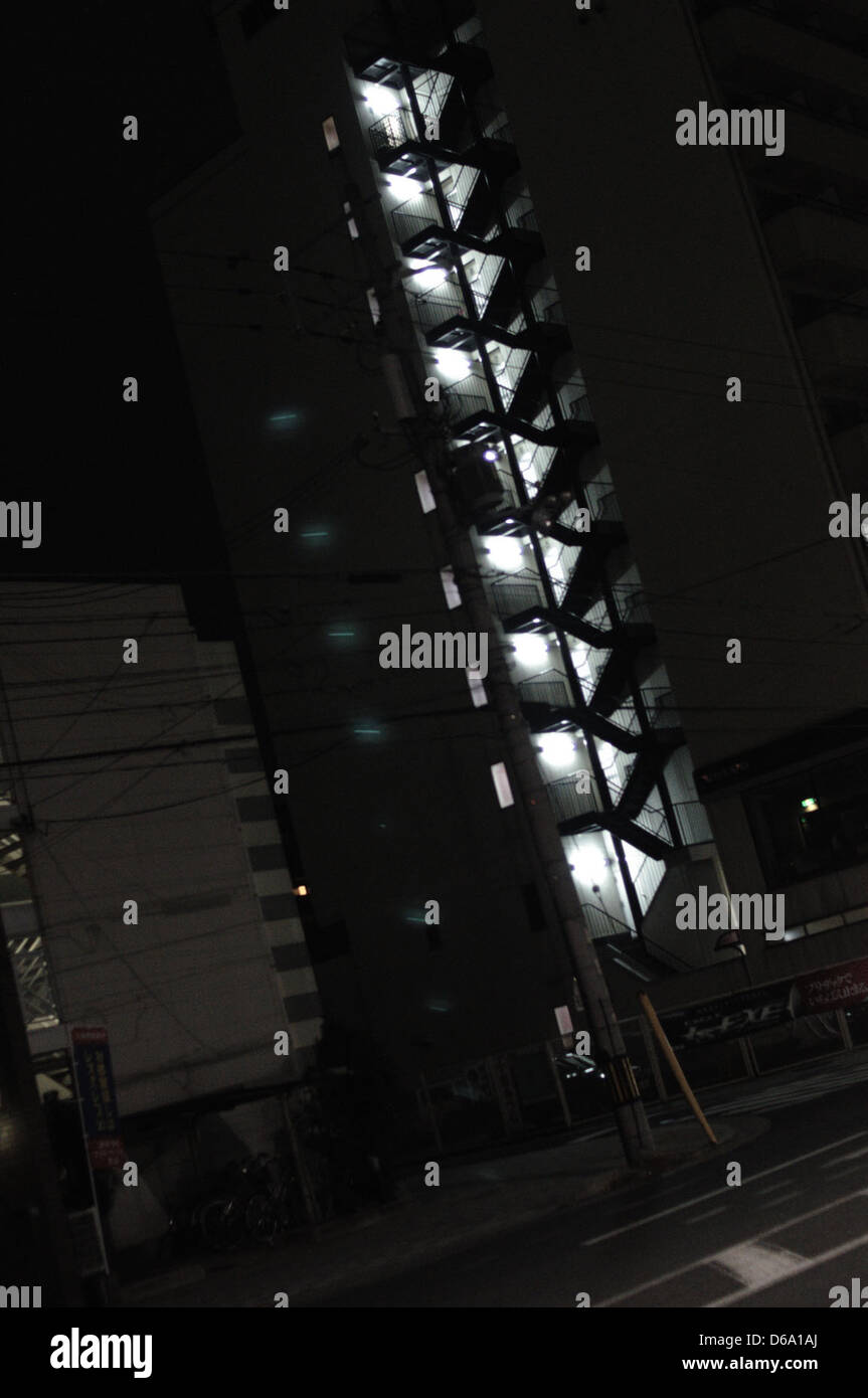The image is an abstract, blurry visual of an outdoor scene with ...