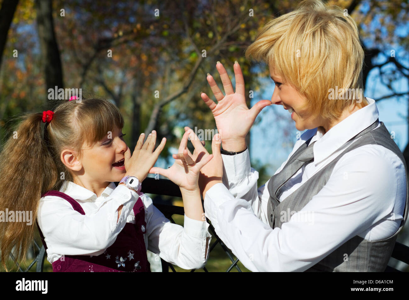 Mother and daughter playing the fool Stock Photo - Alamy