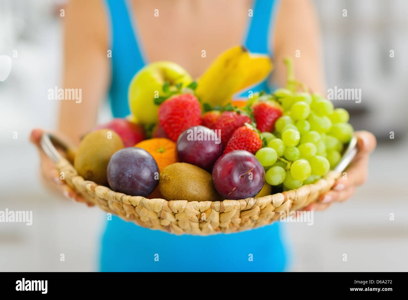 Closeup on plate of fresh fruits giving by woman Stock Photo - Alamy
