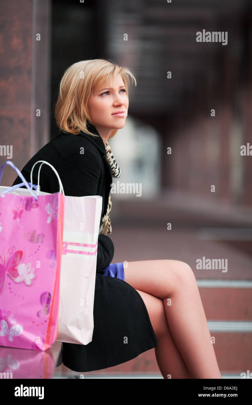 Sad young shopper Stock Photo - Alamy