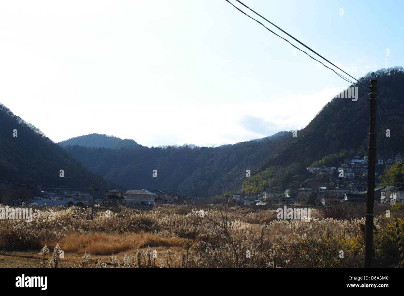 This photograph shows a train traveling through the Kabe Line in North ...