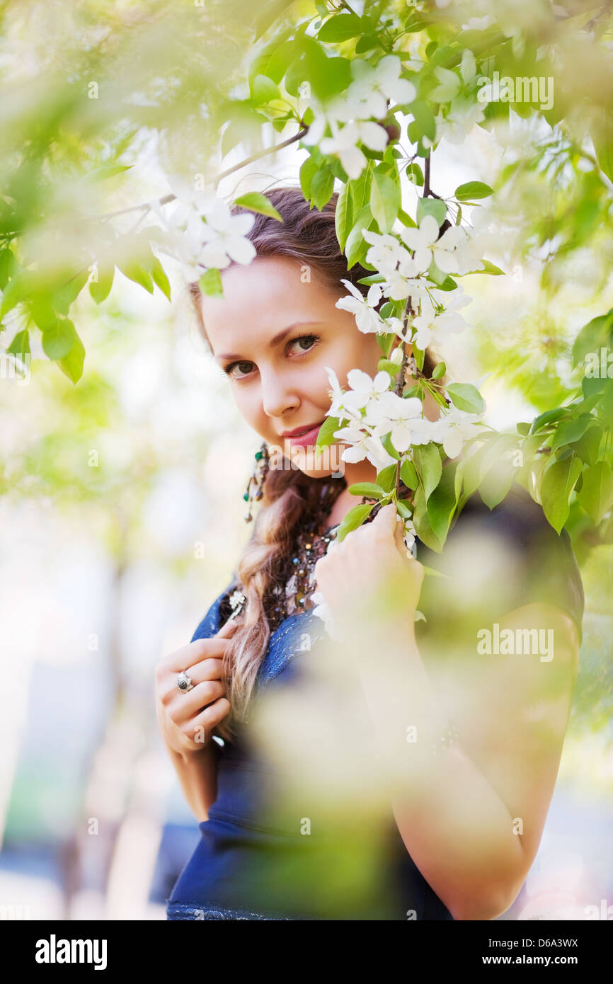 Beautiful woman in a spring garden Stock Photo - Alamy