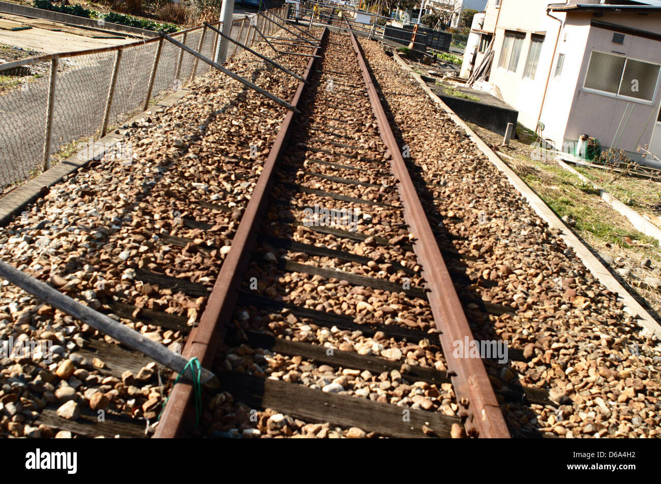 This photo depicts a train passing through a section of the Kabe Line ...