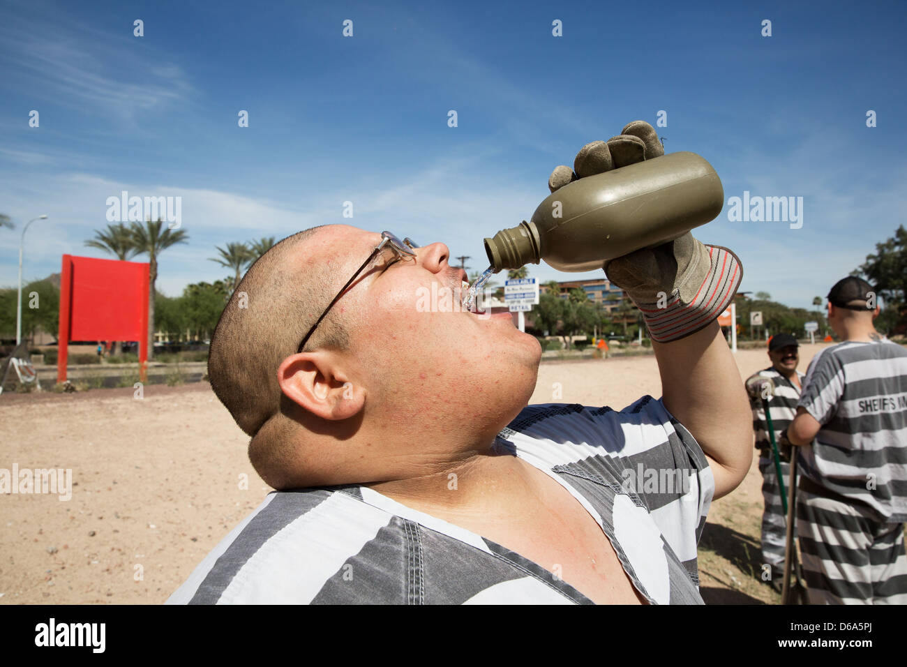An inmate takes a drink of water Stock Photo - Alamy