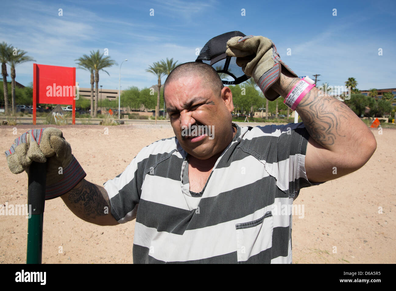 A male inmate feels the heat during chain gang duty Stock Photo - Alamy