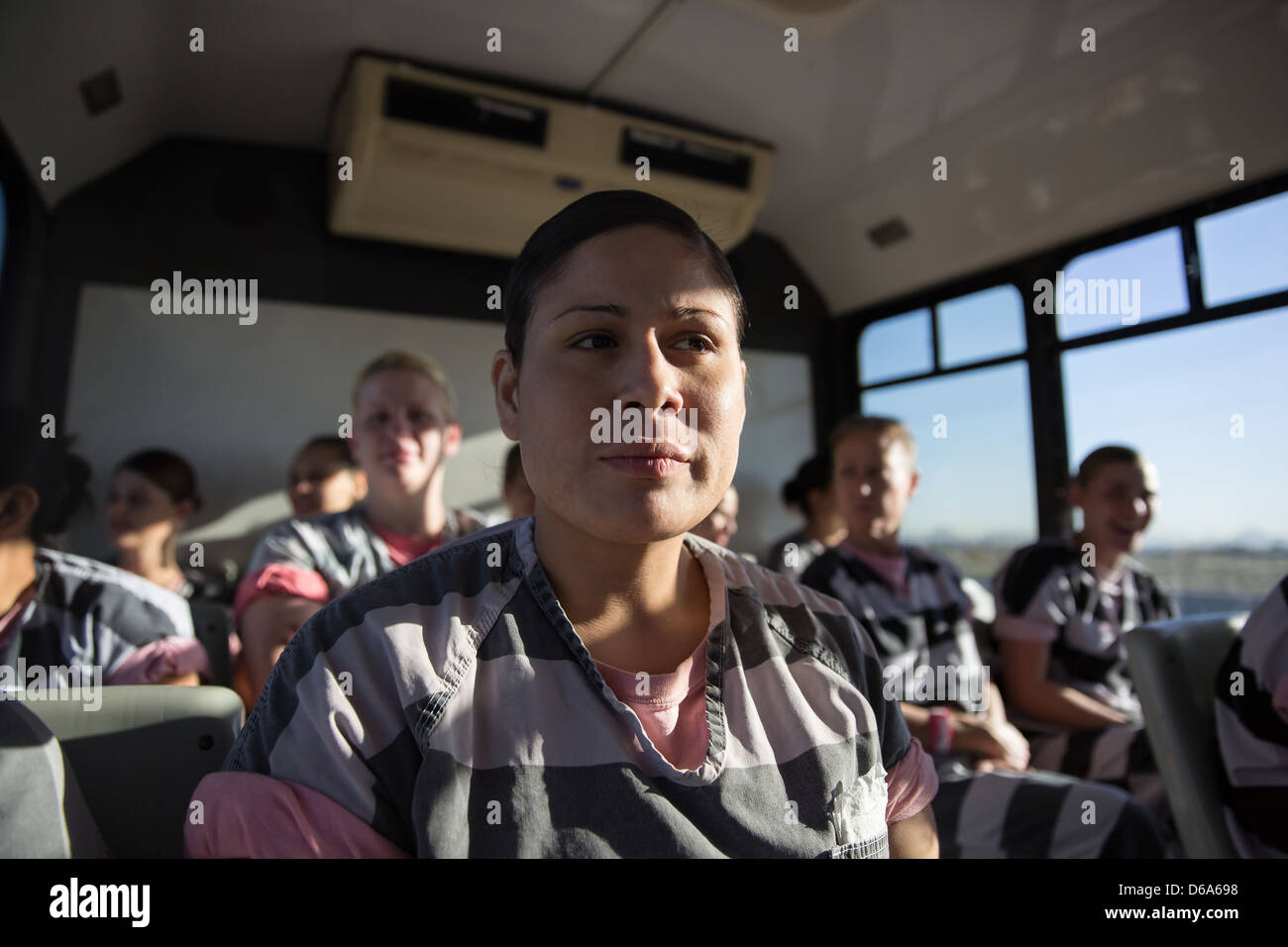 Female inmates on the bus at dawn Stock Photo - Alamy