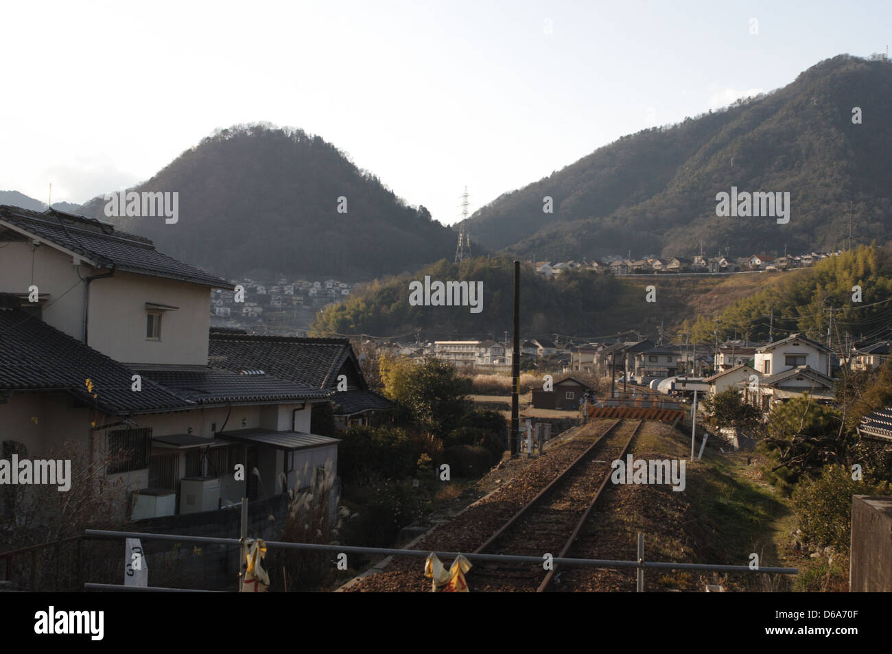 A photo taken from the Kabe Line, showcasing the railway station in ...