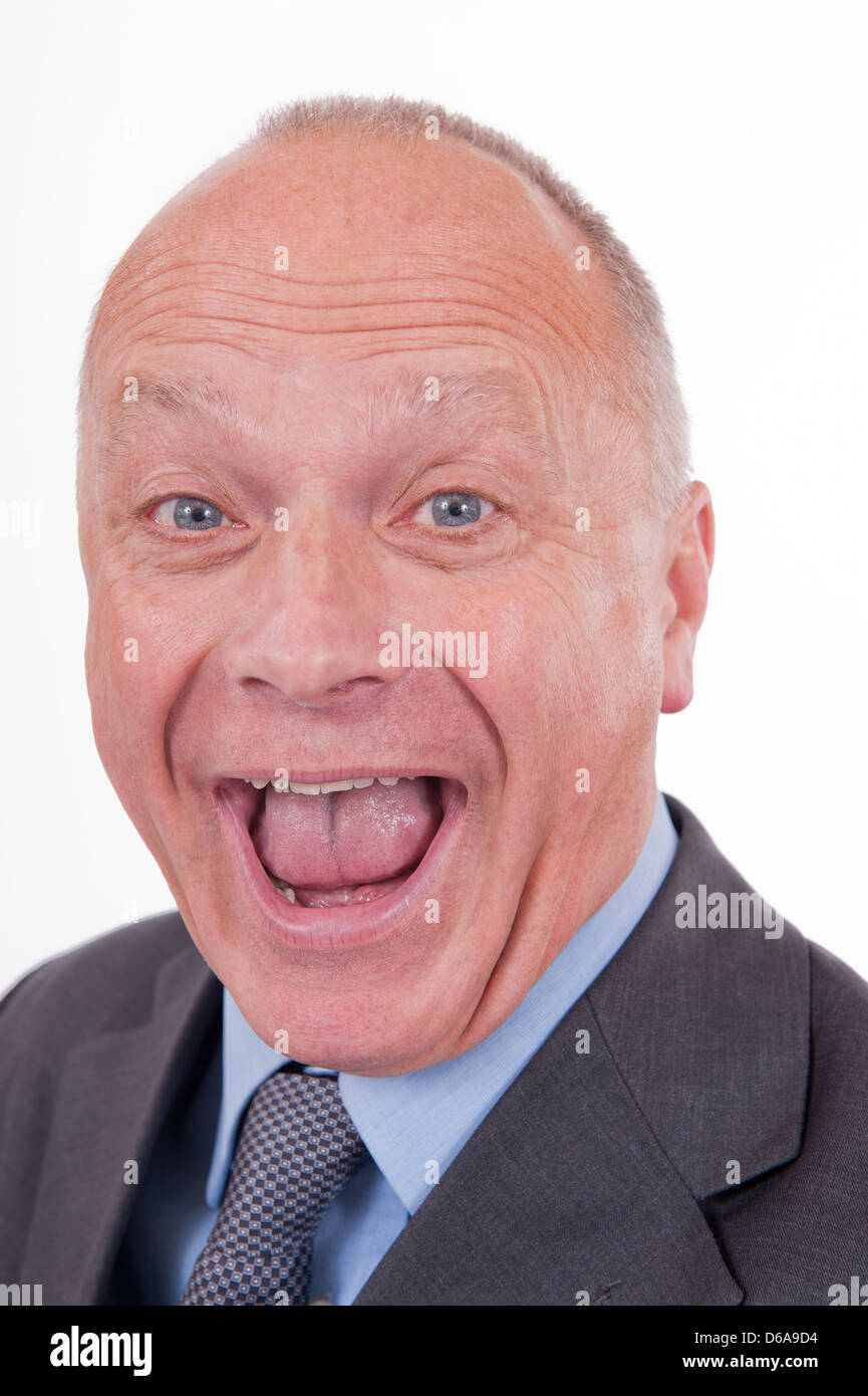 Portrait of a laughing businessman against a plain background Stock ...