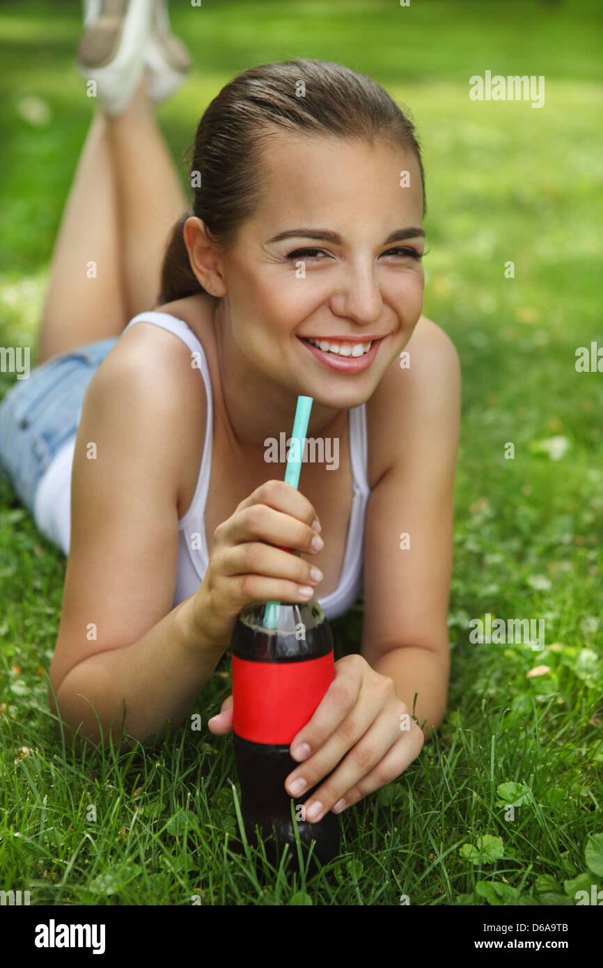 Beautiful young drinking girl Stock Photo - Alamy
