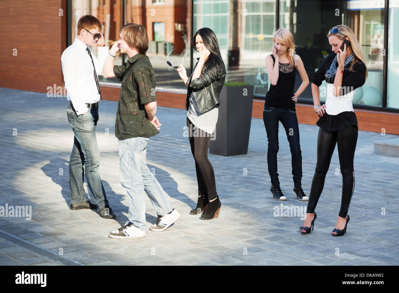 Young people calling on the mobile phones Stock Photo - Alamy