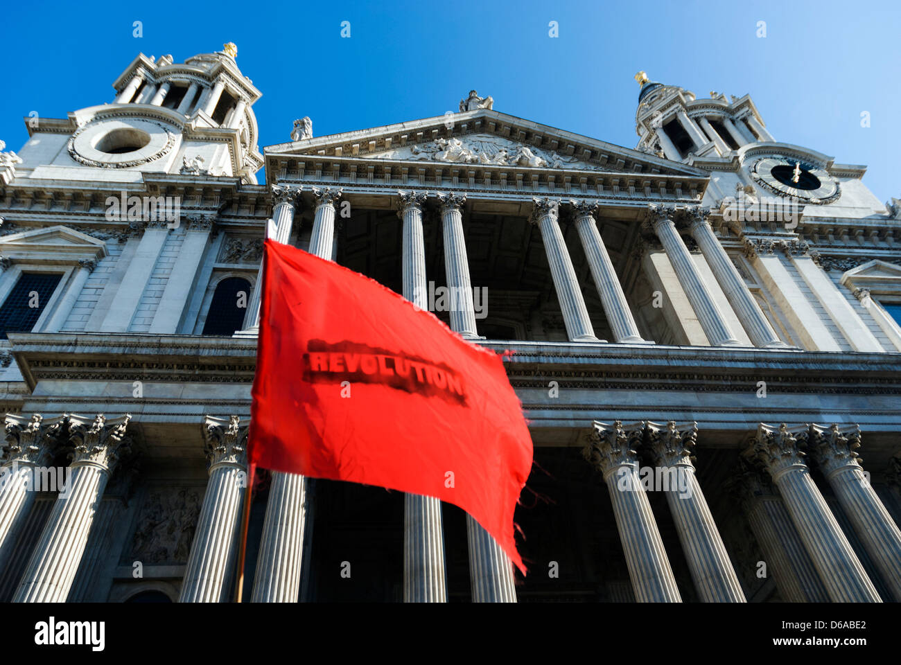 Protesters are carrying red flag at the front of St Paul Cathedral ...