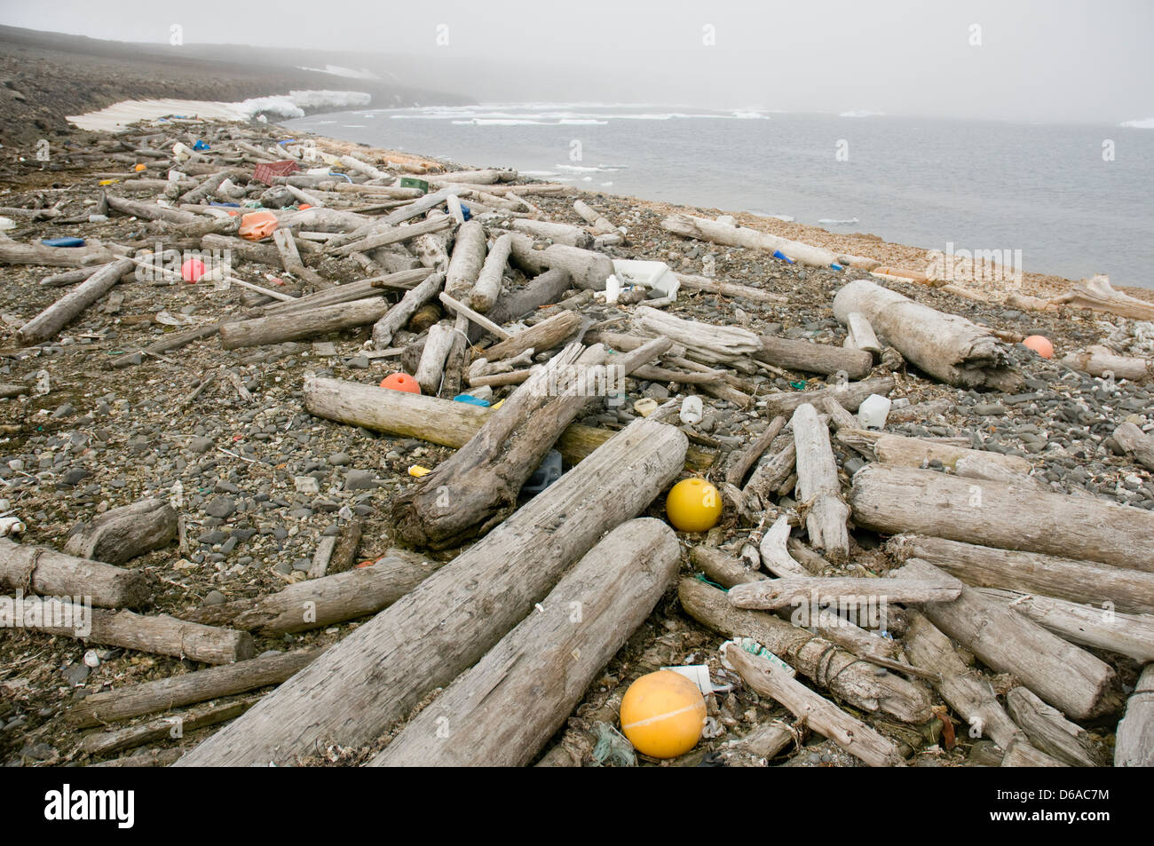 Norway, Svalbard Archipelago, Spitsbergen. Buoys and garbage litter a ...