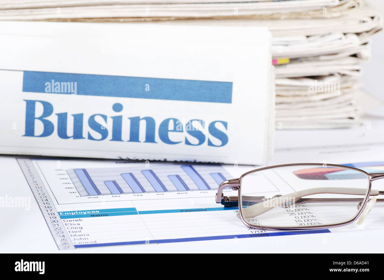Business the newspaper with chart Stock Photo - Alamy