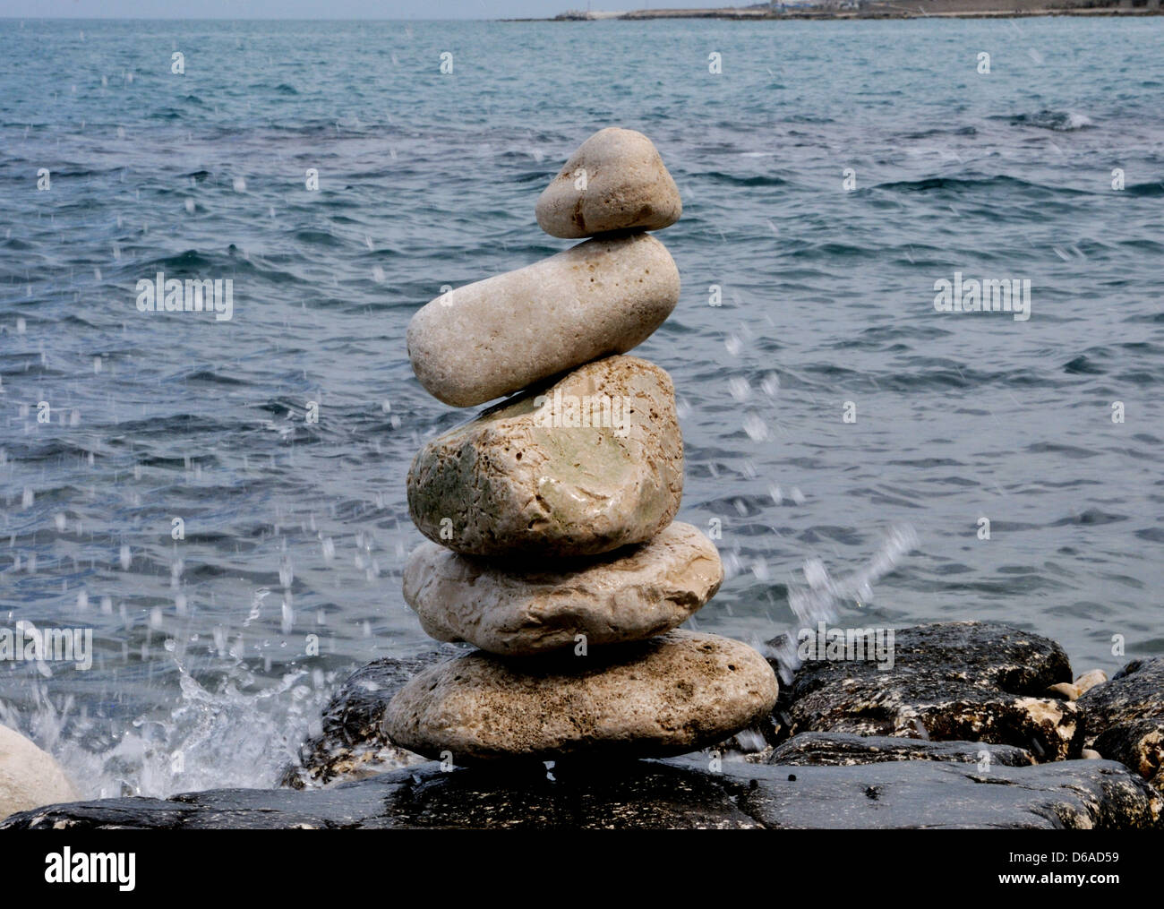 Stones in balance on the rocks of the sea Stock Photo - Alamy