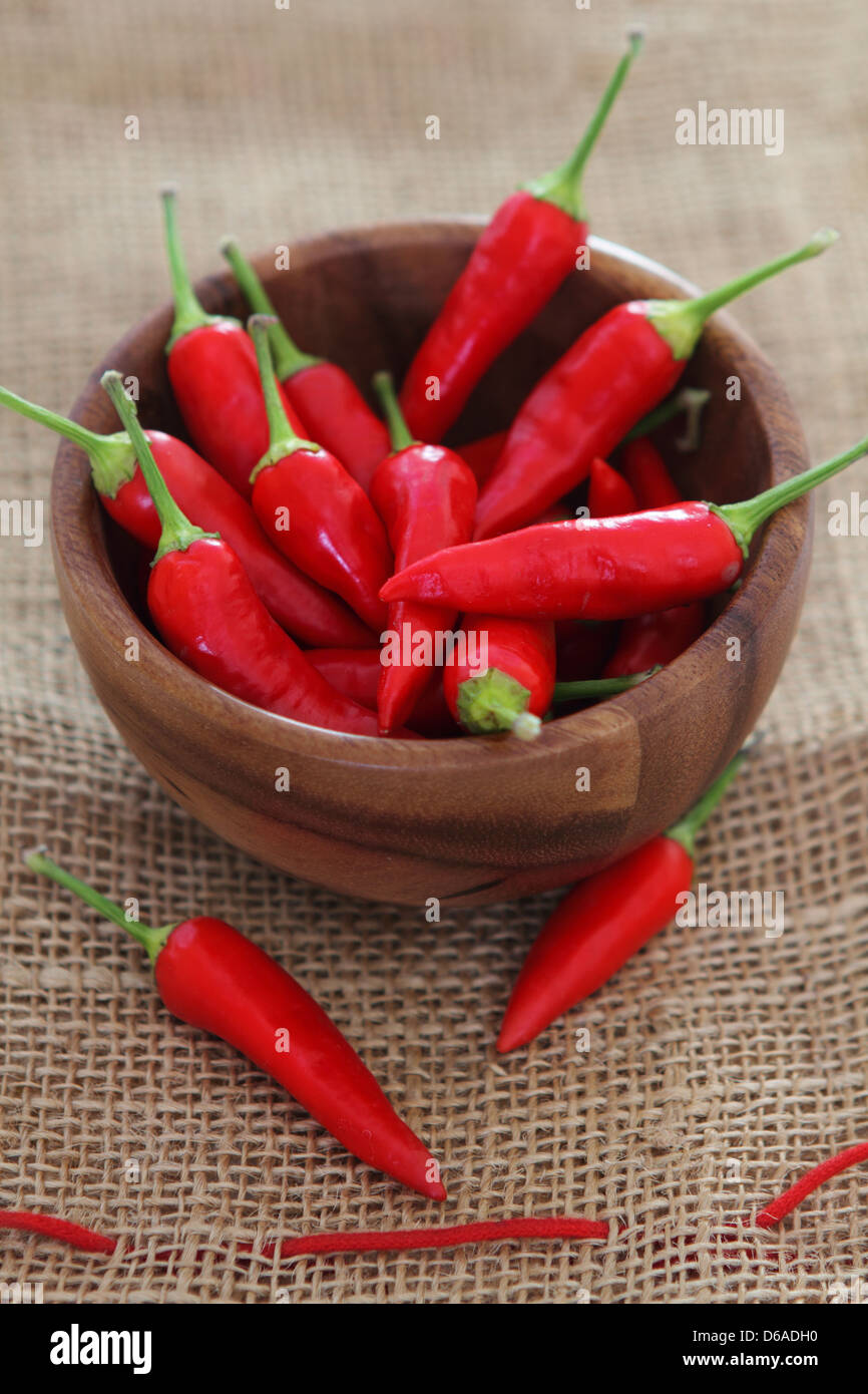 Red hot pepper in wooden bowl Stock Photo - Alamy