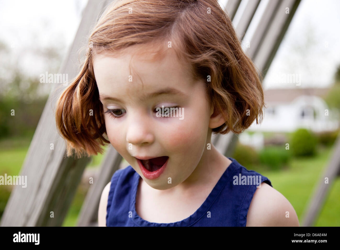 Surprised Girl Looking Down Stock Photo - Alamy