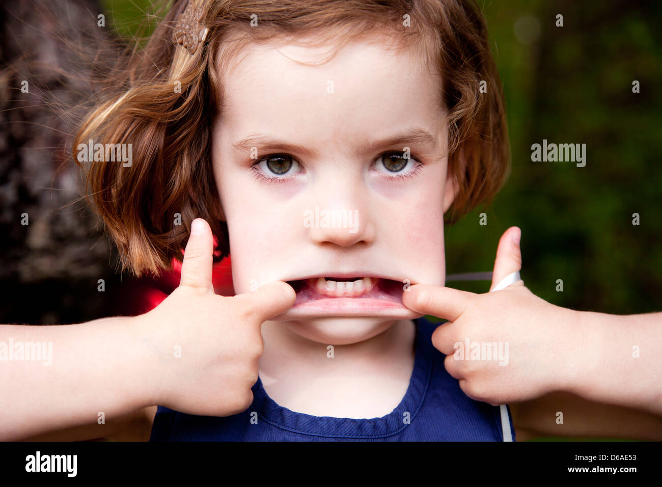 Girl Making Funny Face Stock Photo - Alamy
