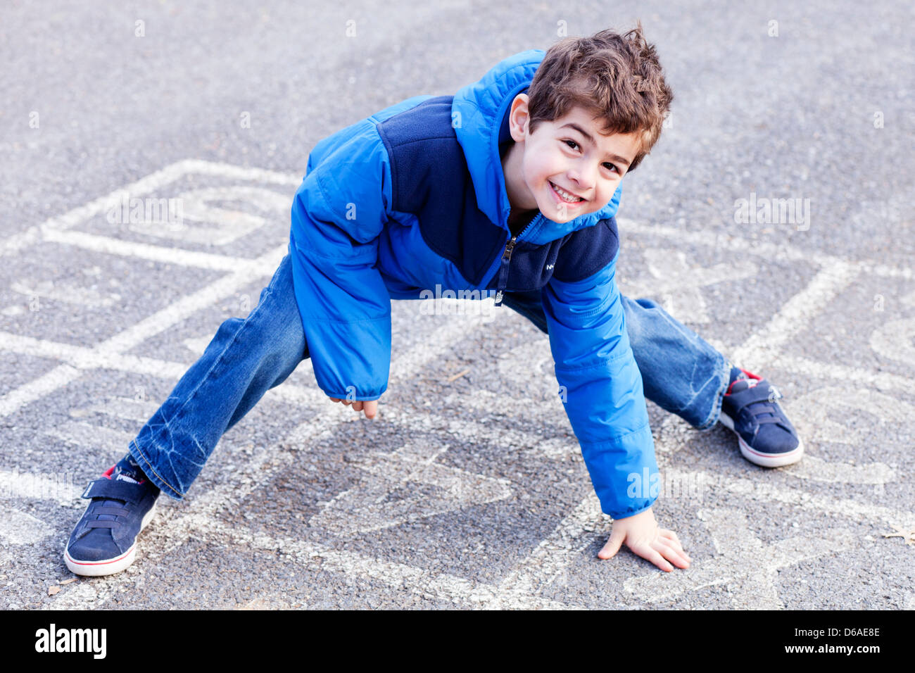 Boy Playing Hopscotch Outside On High Resolution Stock Photography and ...