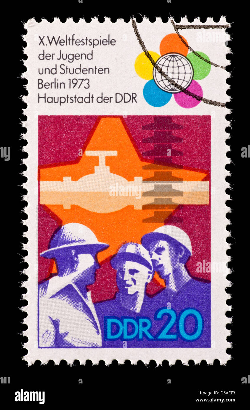 Postage stamp from East Germany (DDR) depicting construction workers ...